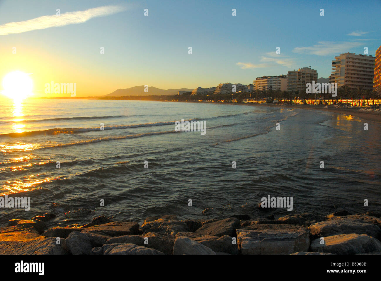 Sunset over Marbella Beach on the Costa del Sol, Andalucia Spain Stock ...
