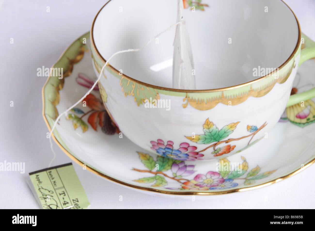 Tea Bag Standing up in Flowered Cup Stock Photo - Alamy