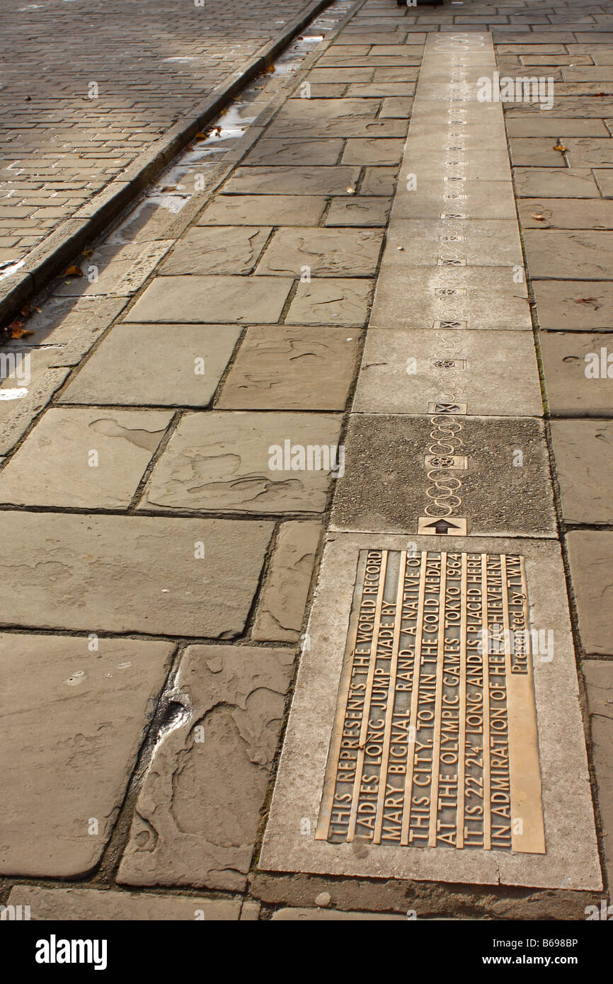 Pavement plaque commemorating Mary Rand's world record 6.76m long jump ...