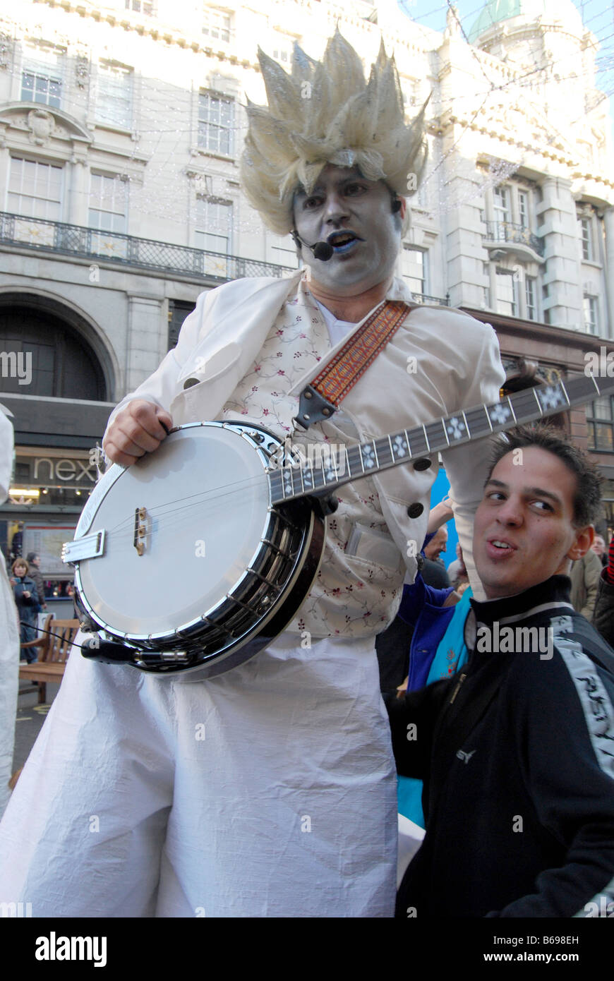 Street performers regent street Christmas sales event Stock Photo - Alamy
