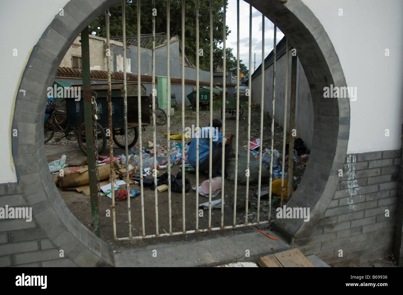 A scavenger picks plastics to sell for recycle Stock Photo - Alamy