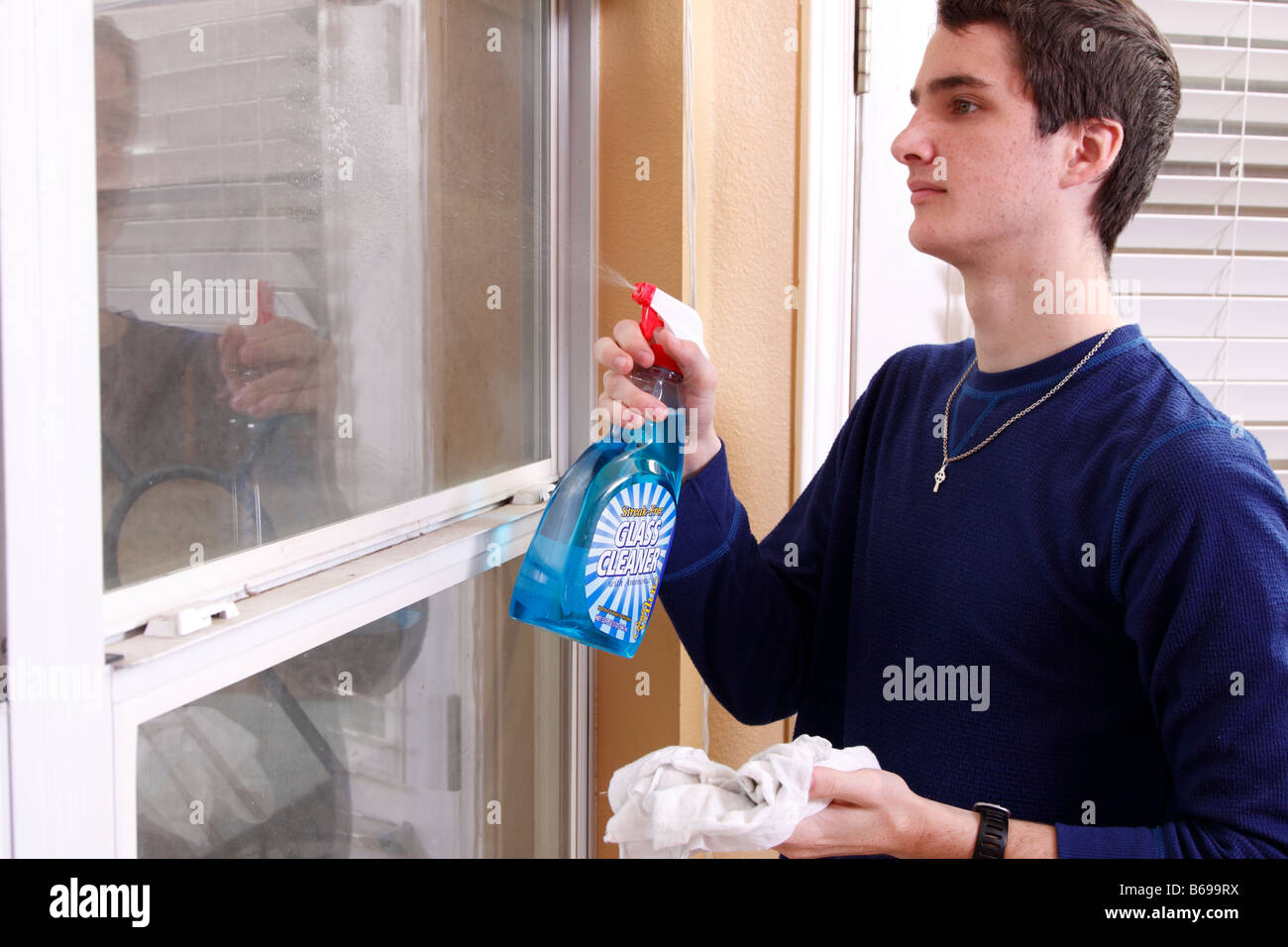 teen washing a window Stock Photo - Alamy