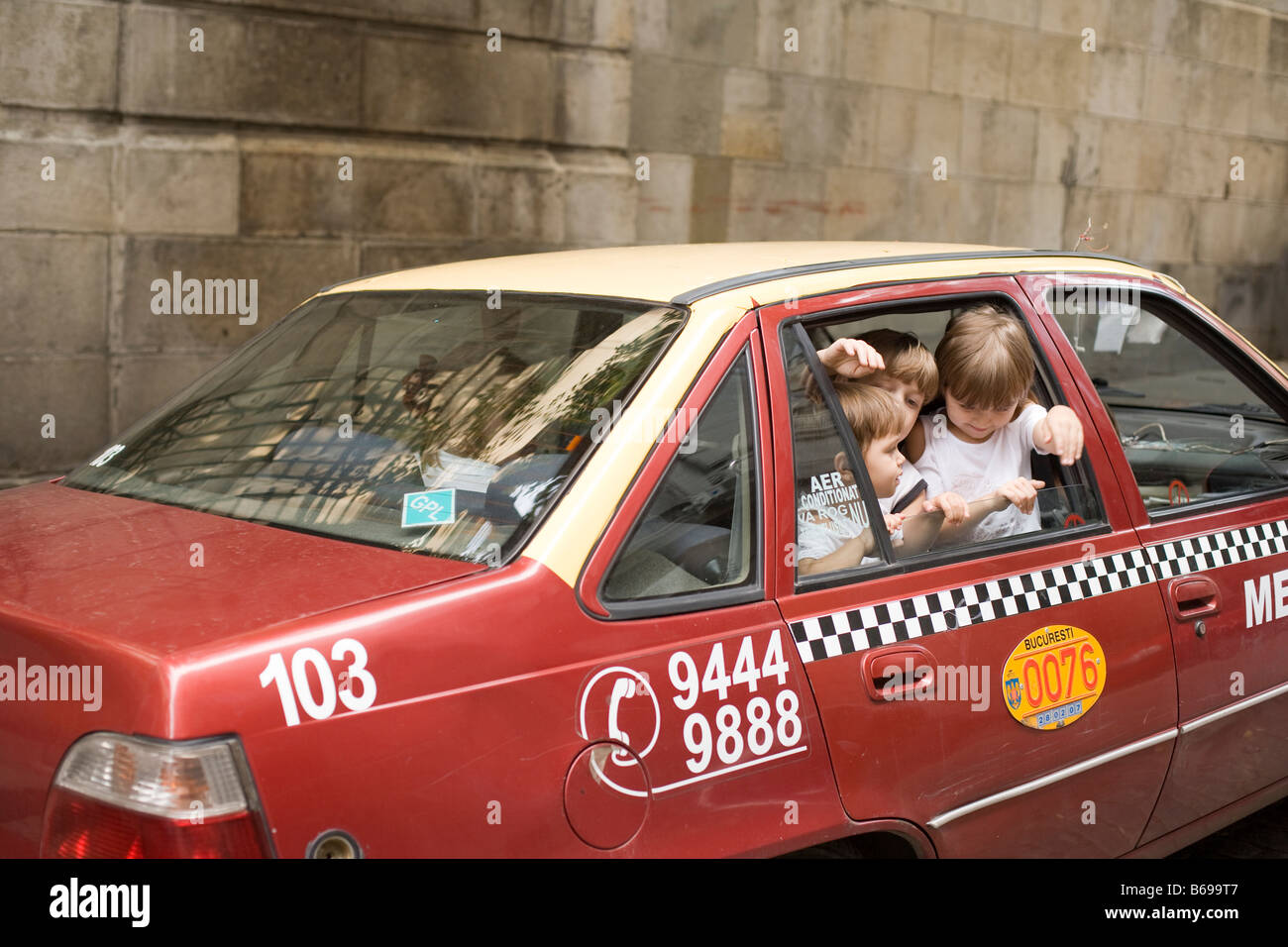 three children in a taxi cab Stock Photo - Alamy