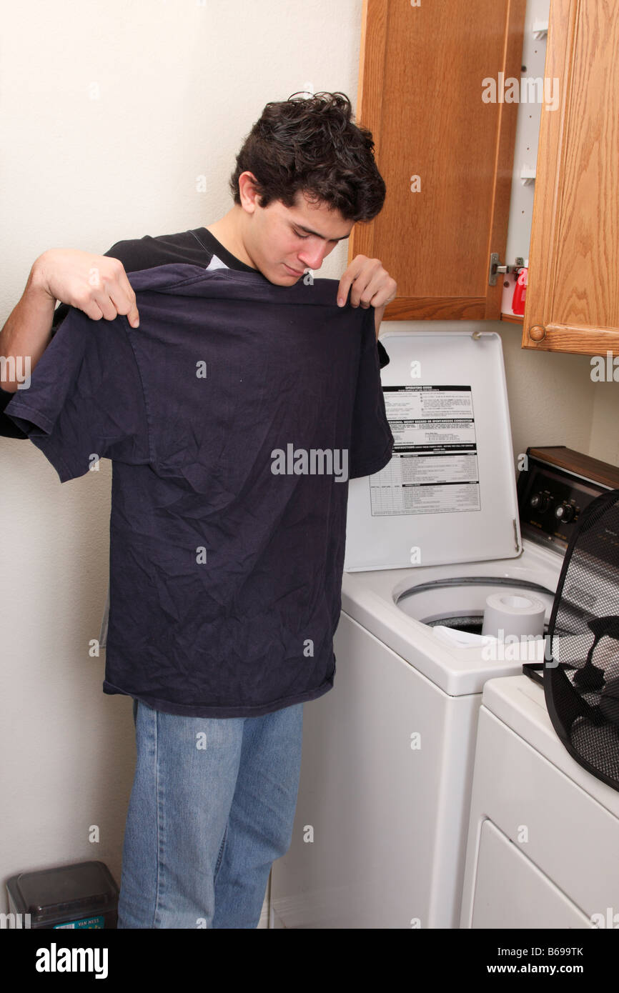 Teen doing laundry Stock Photo - Alamy