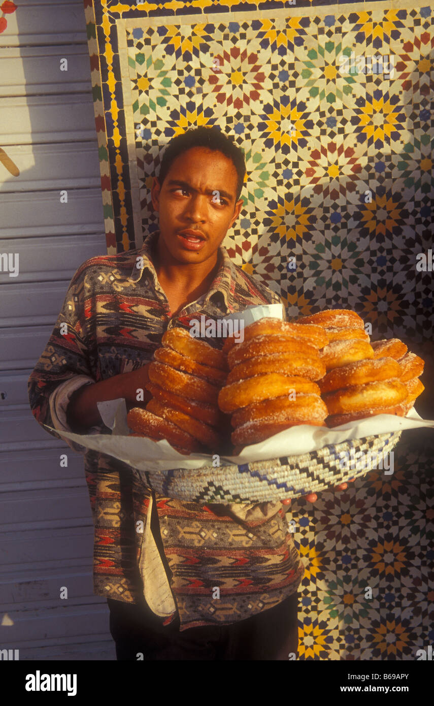 Man selling donuts in Djamaa El Fna Morocco Stock Photo - Alamy
