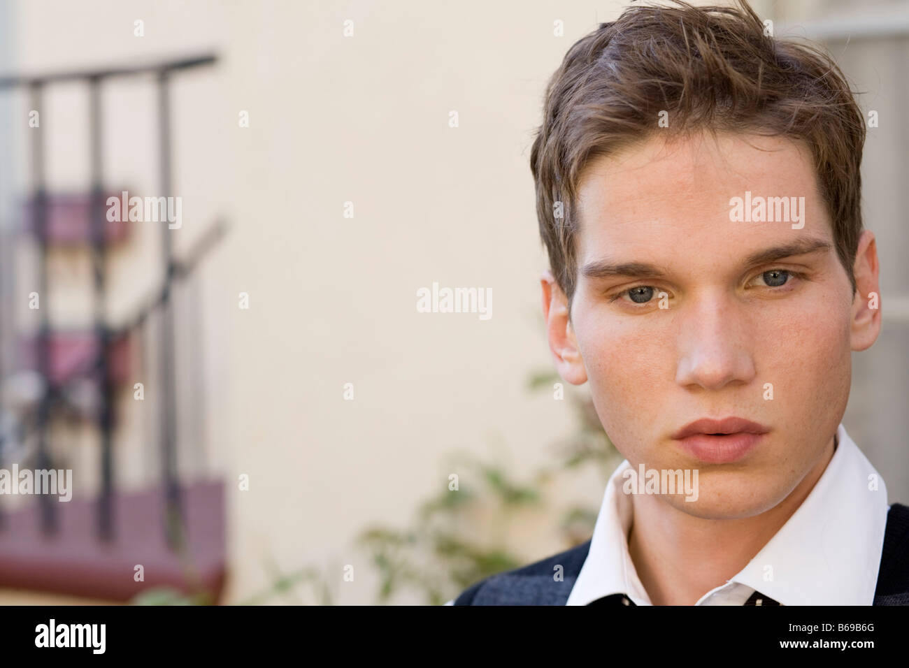 Young man serious, portrait Stock Photo - Alamy