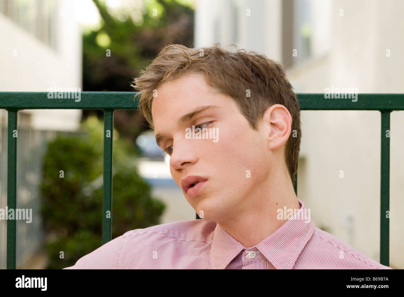Young man serious, portrait [looking down] Stock Photo - Alamy
