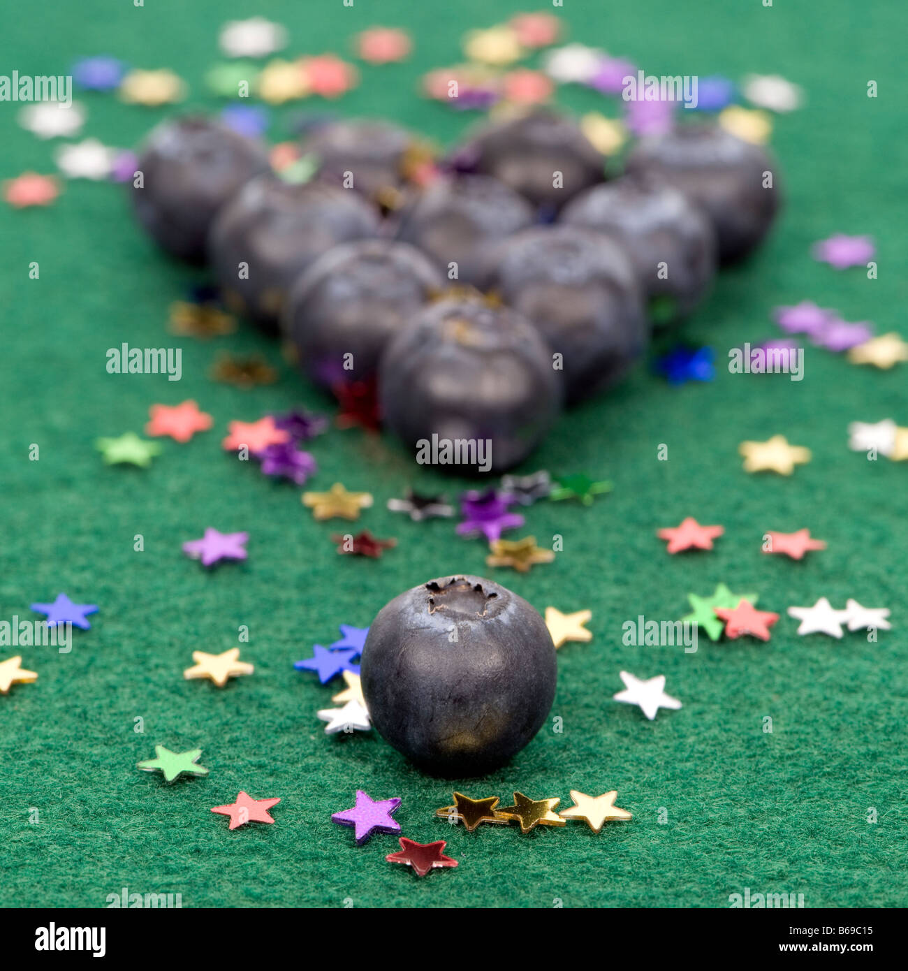 Blueberries arranged on the green background with stars Stock Photo - Alamy