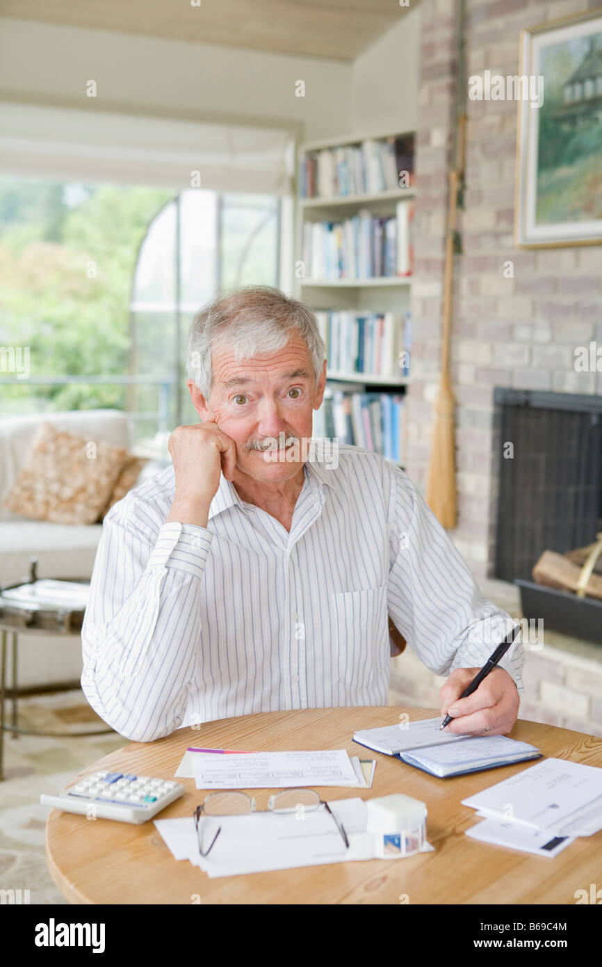 Man preparing home finance budget Stock Photo - Alamy
