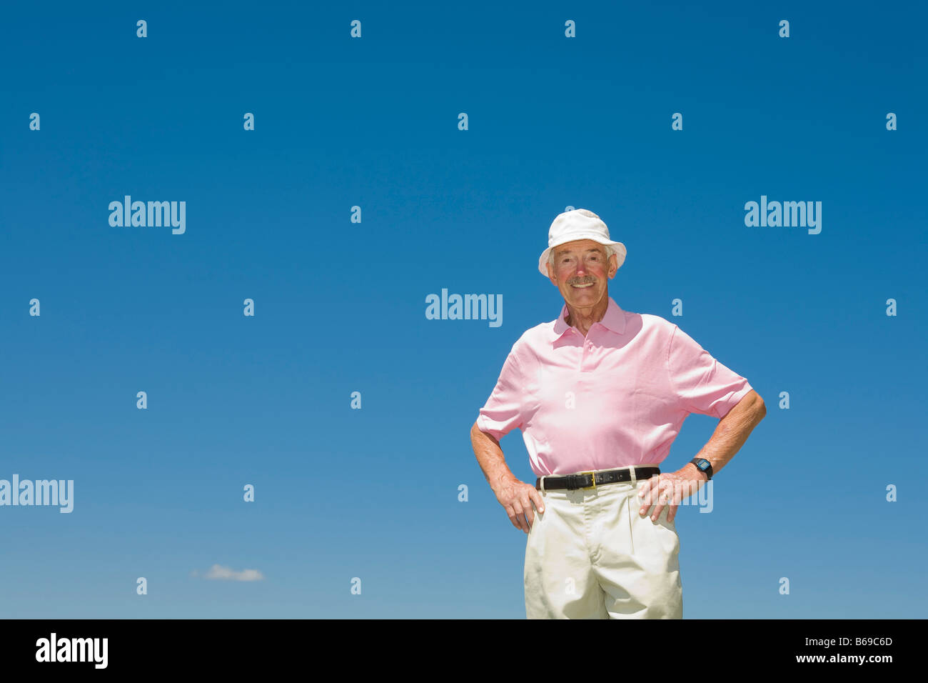 Confidence arms akimbo man hi-res stock photography and images - Alamy