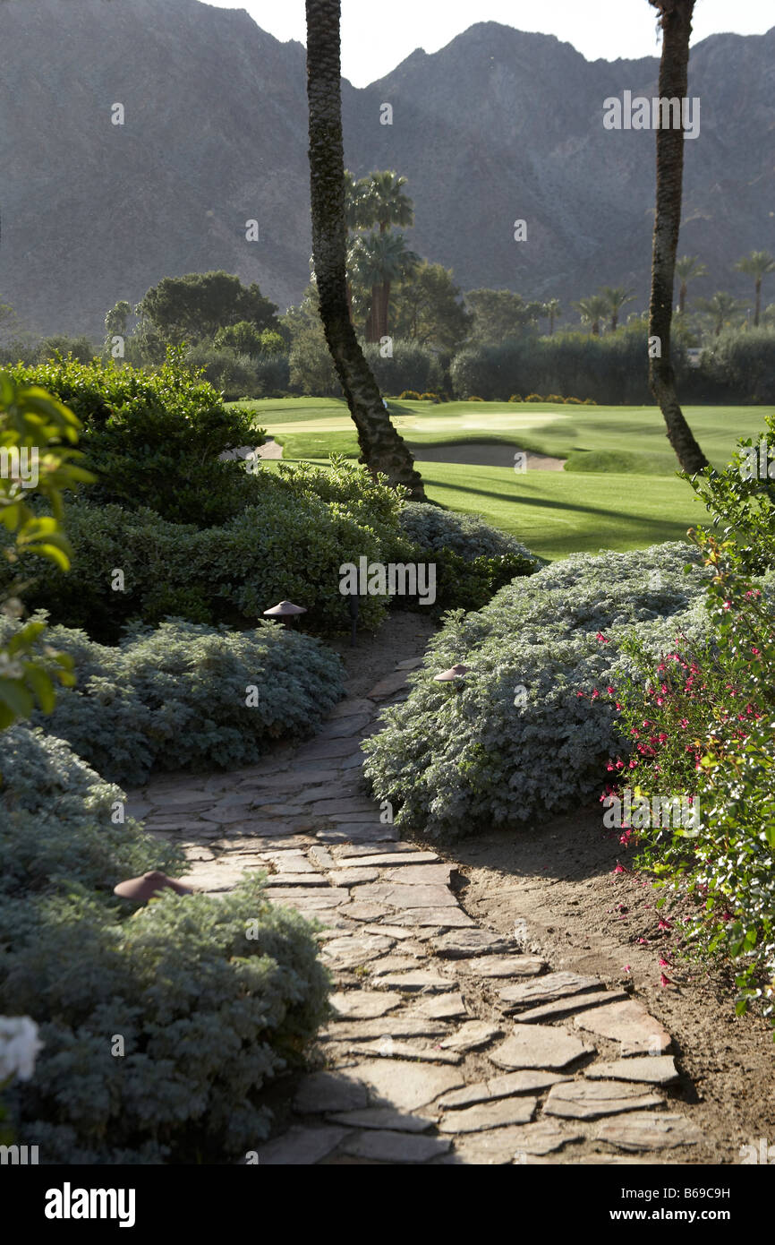 Garden pathway to golf course Stock Photo - Alamy