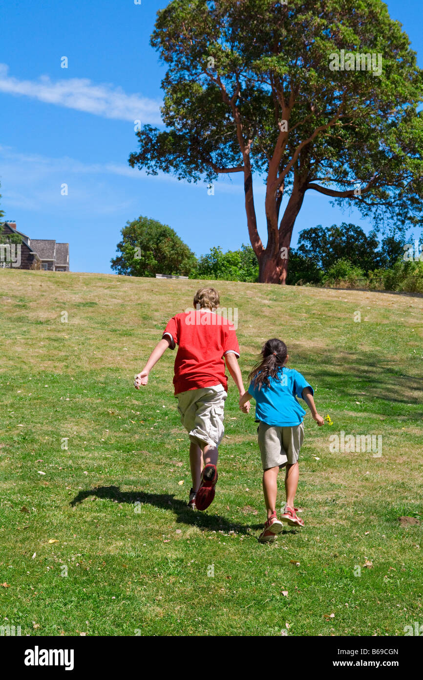 Two friends playing in a park Stock Photo - Alamy