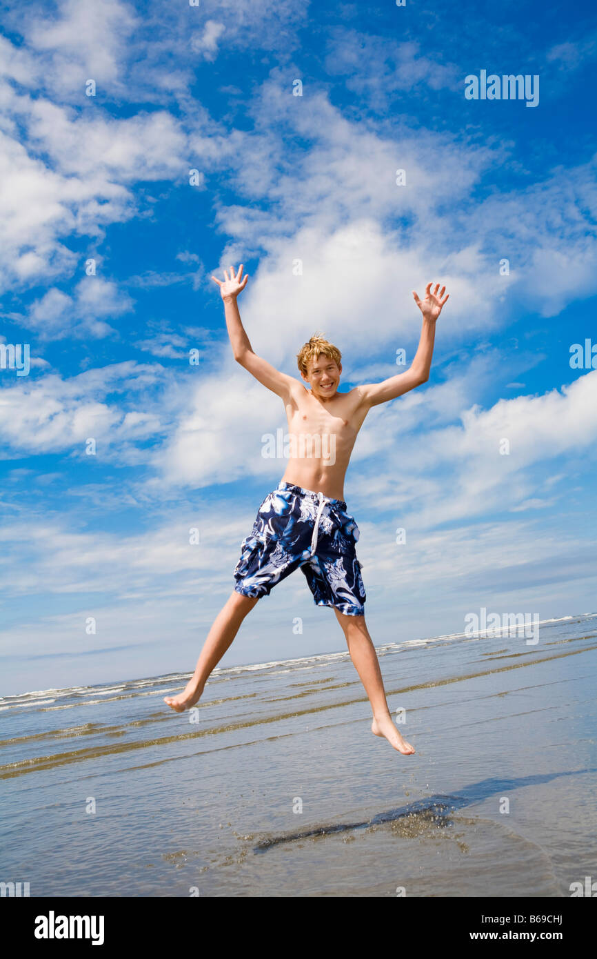 Boy jumping on the beach, Washington State, USA Stock Photo - Alamy