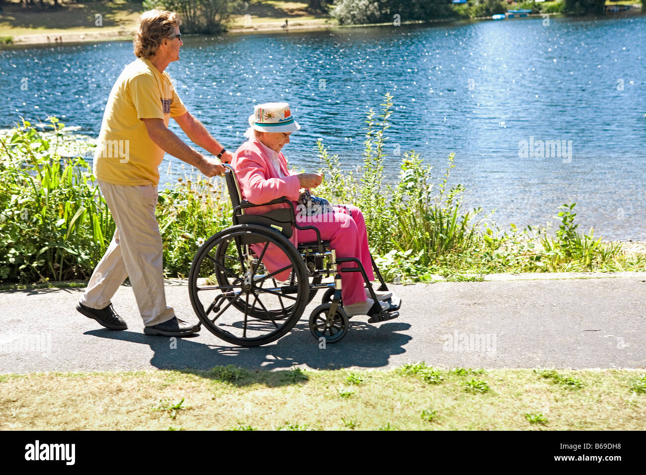 Old Man Pushing Wheelchair High Resolution Stock Photography and Images ...