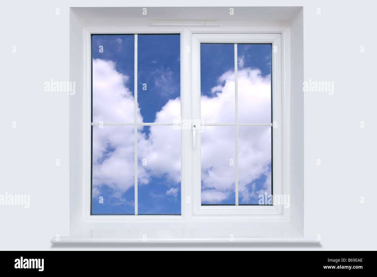 Blue cloudy sky seem through a white window frame Stock Photo - Alamy