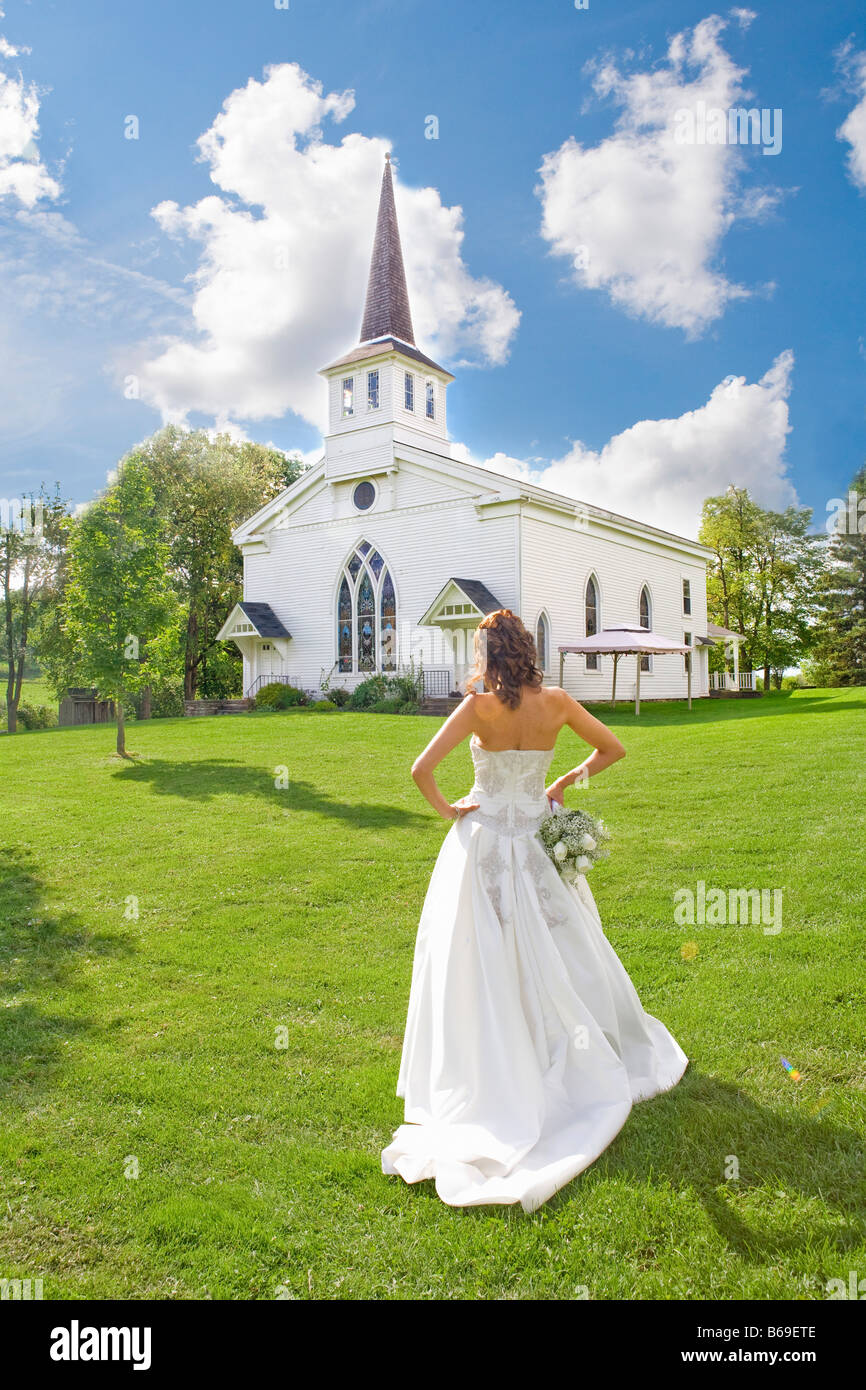 Bride standing near a church, East Meredith, New York State, USA Stock ...