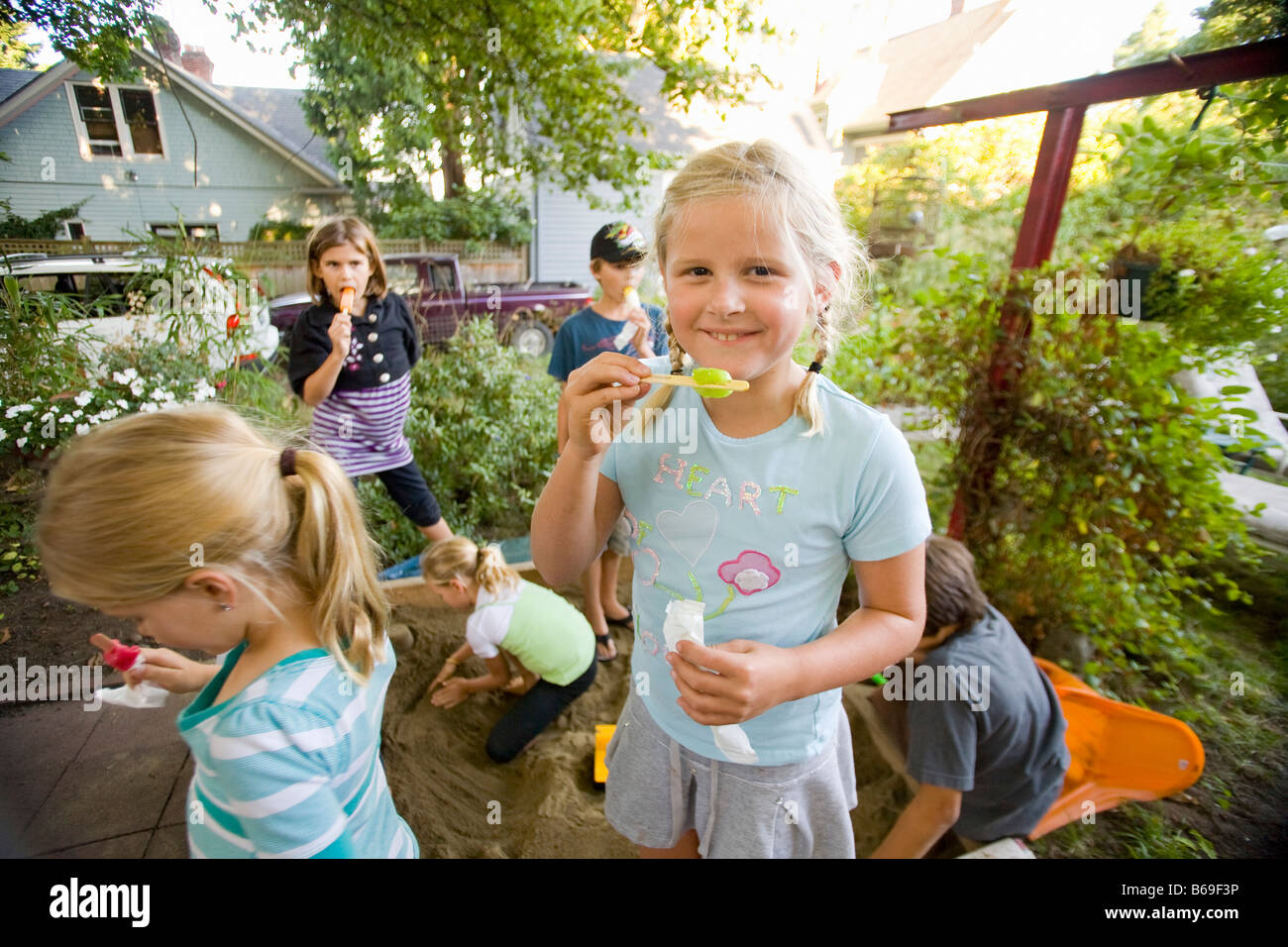 Children eating popsicles Stock Photo - Alamy