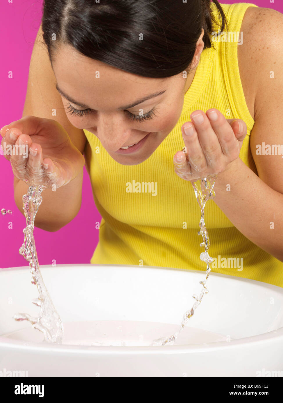 Young Woman Washing Face Model Released Stock Photo - Alamy