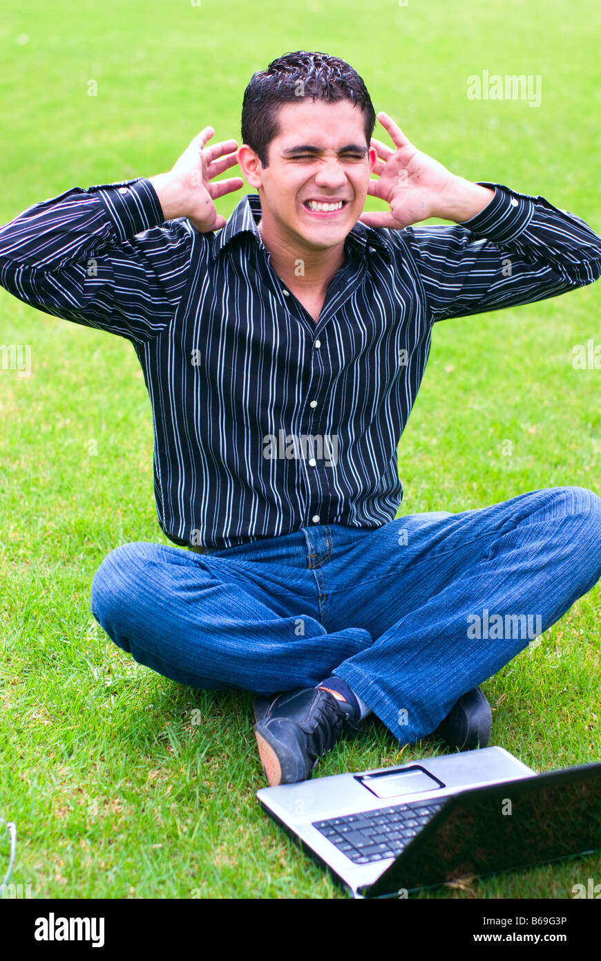 angry boy with laptop Stock Photo - Alamy