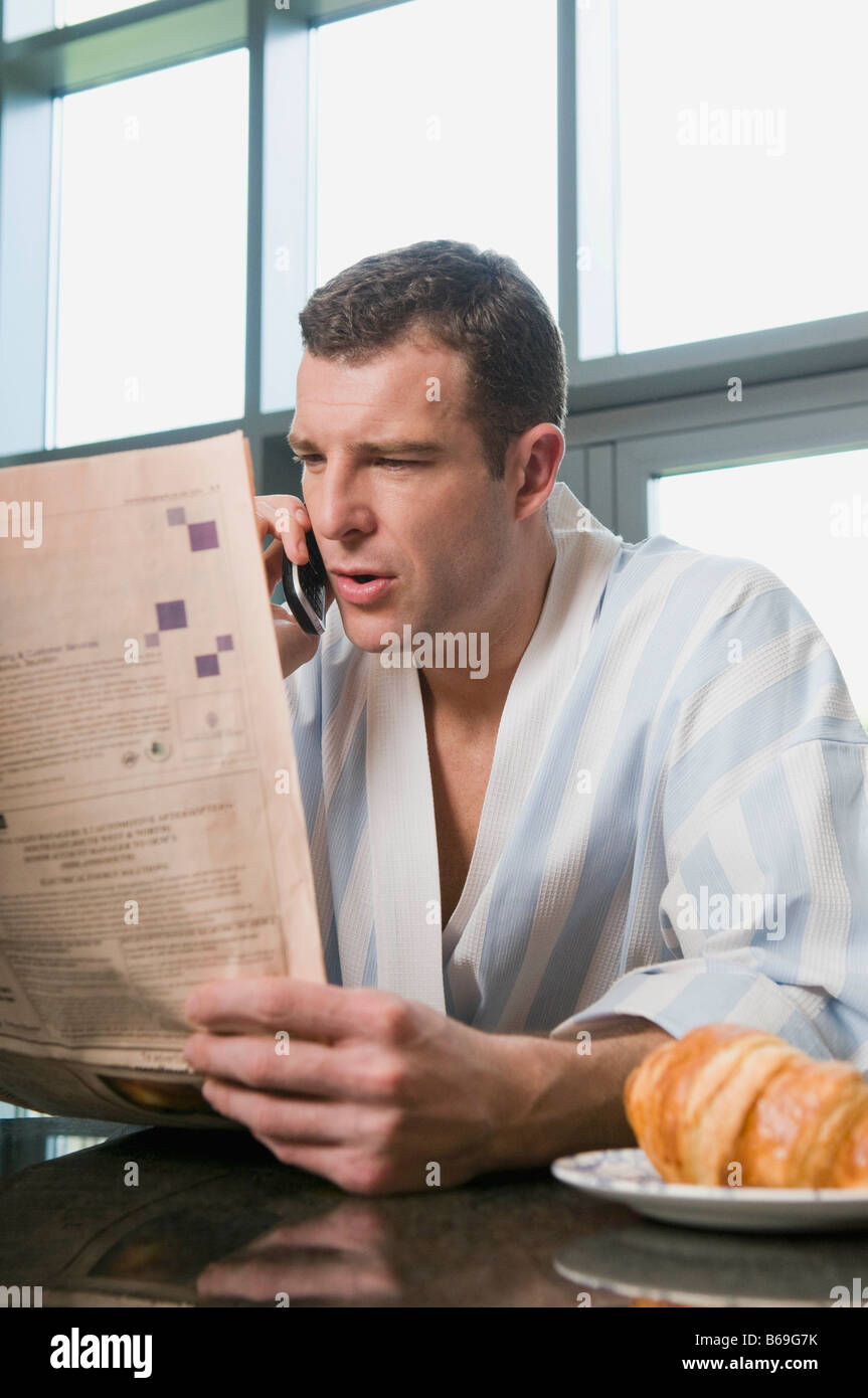 Portrait of a male reading the paper Stock Photo - Alamy