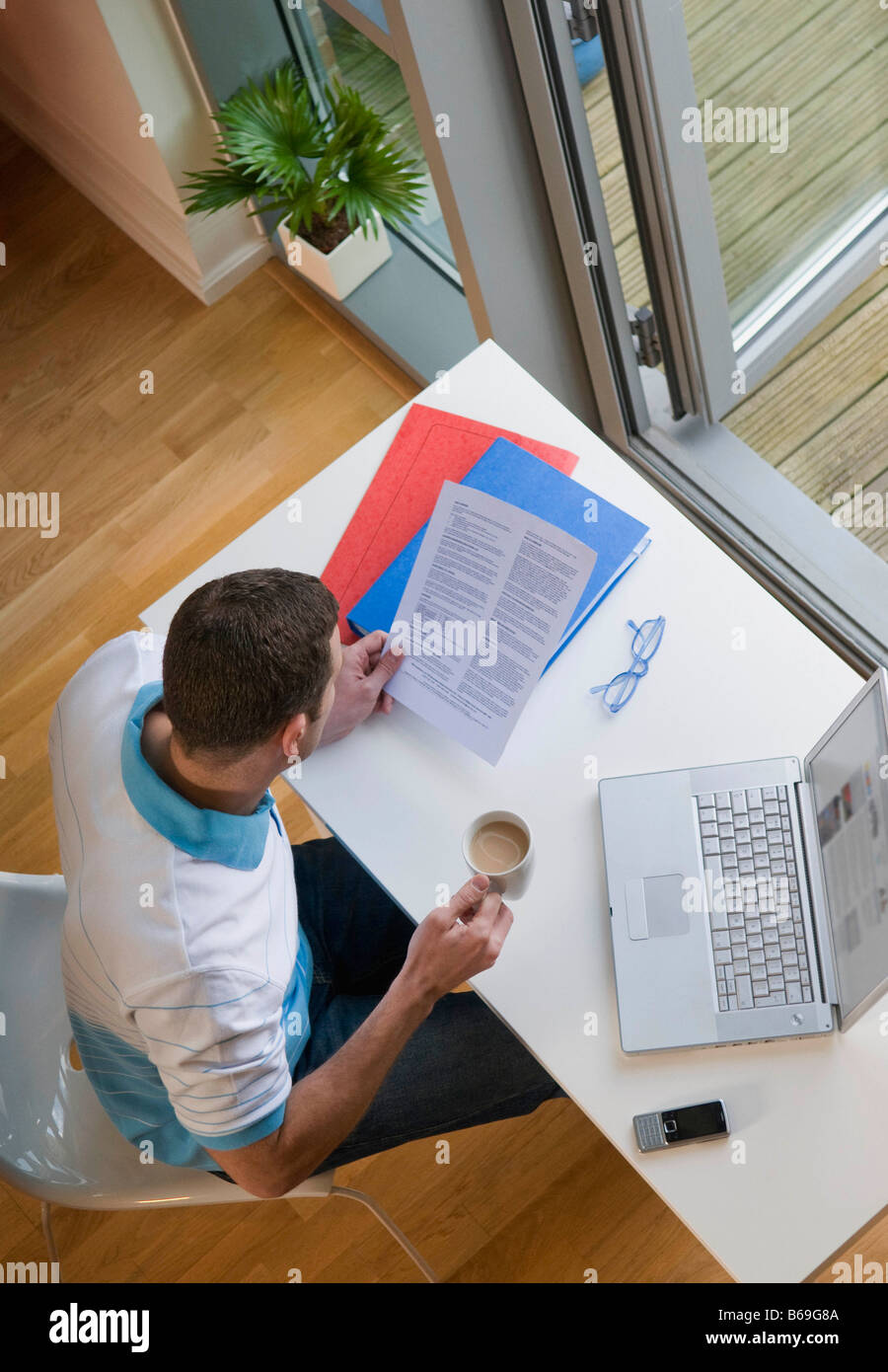 A man working from home Stock Photo - Alamy