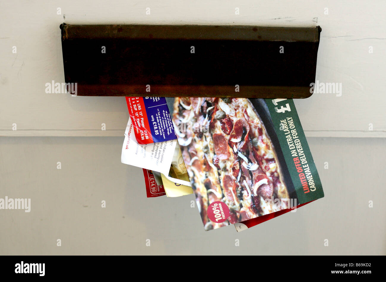 Flyers & leaflets delivered through letterbox Stock Photo - Alamy