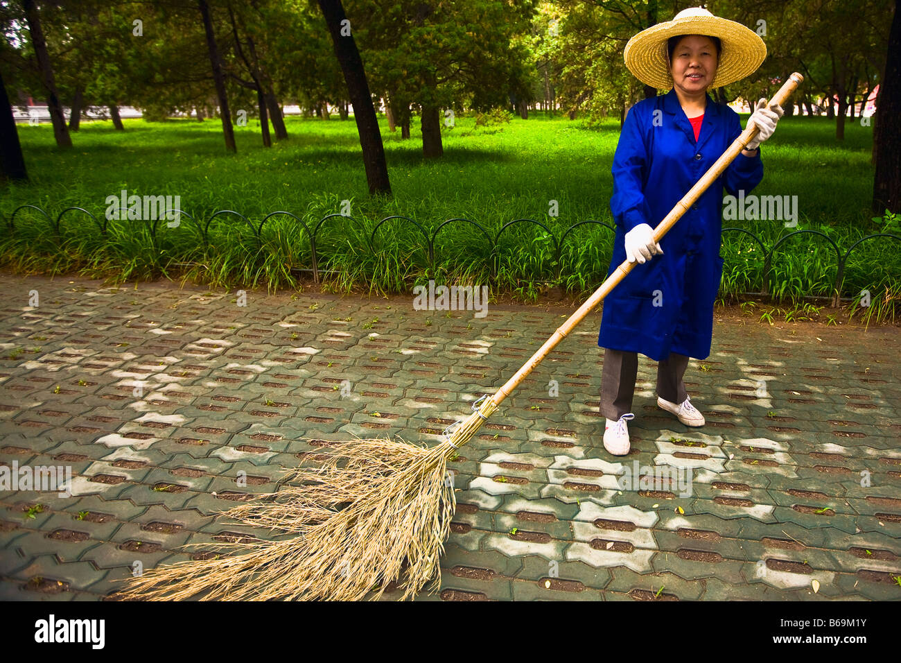 Portrait of a female sweeper sweeping, Temple of Heaven, Beijing, China ...