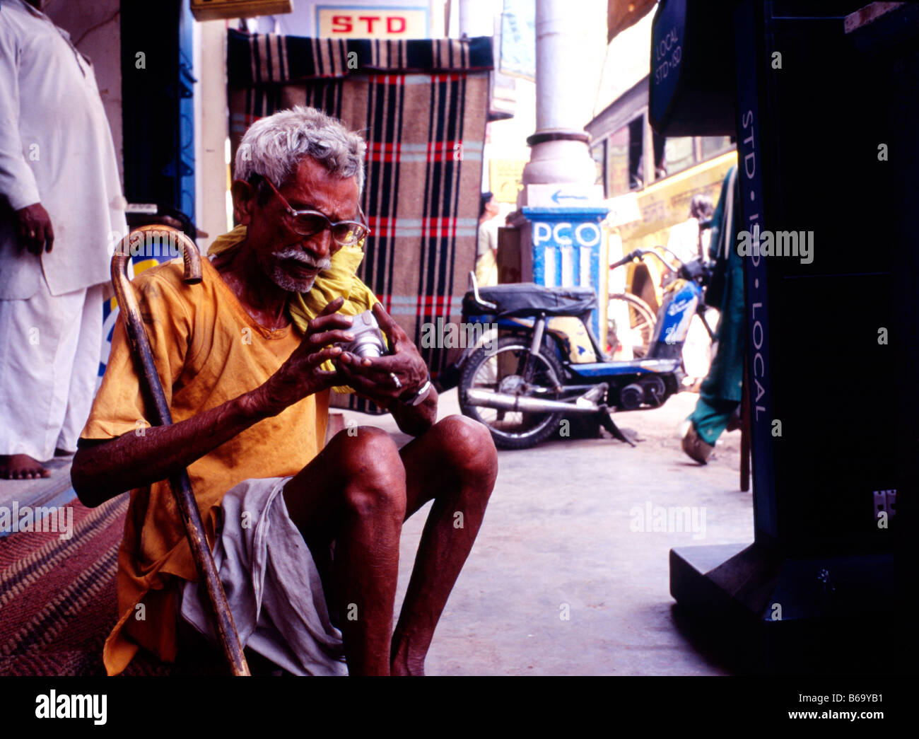 man looking at digital camera, India Stock Photo - Alamy
