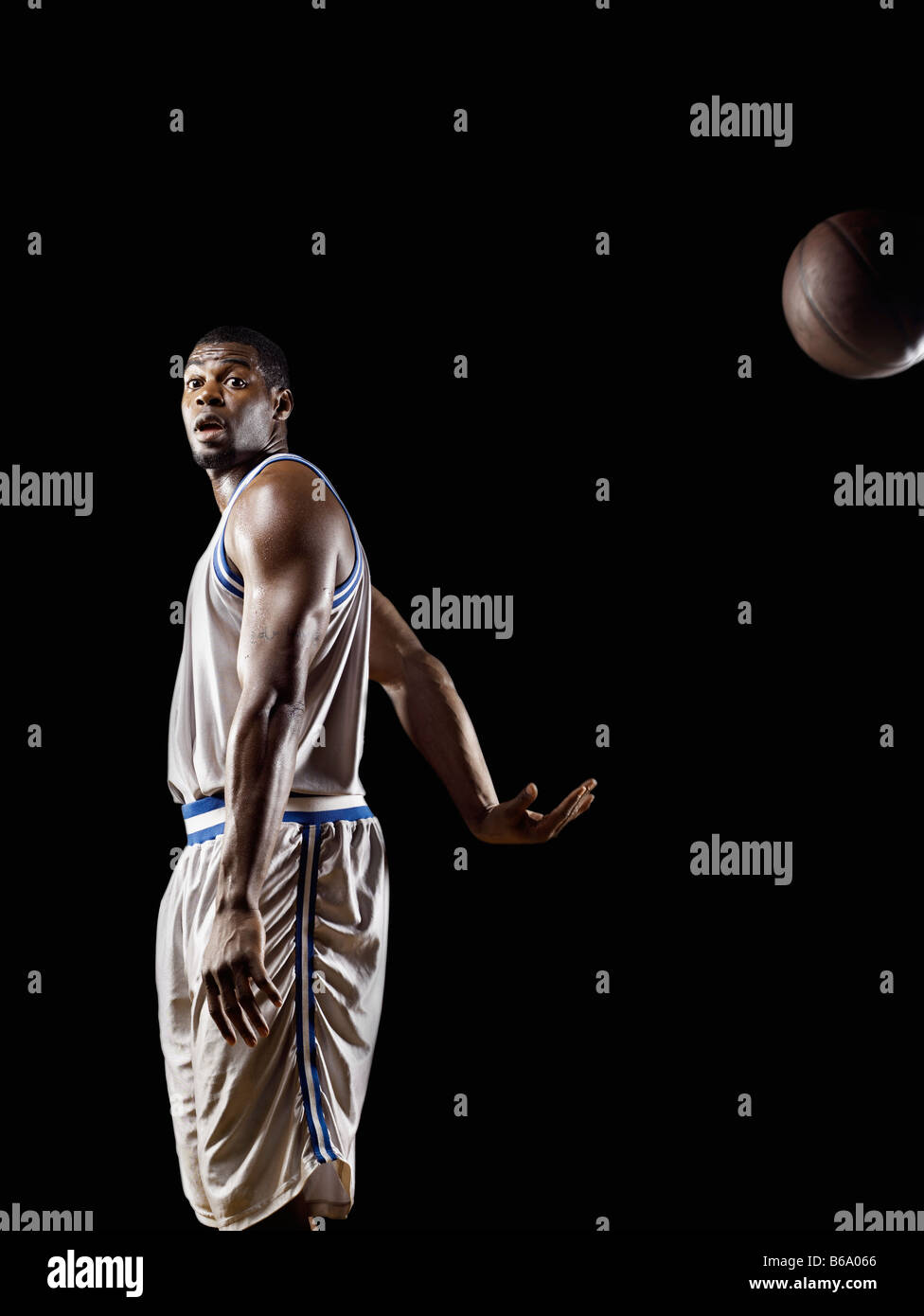 African basketball player passing basketball Stock Photo - Alamy