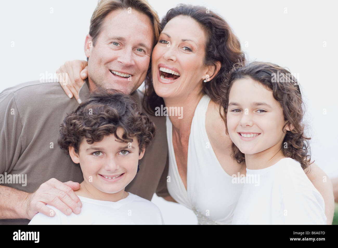Happy family posing for portrait Stock Photo - Alamy