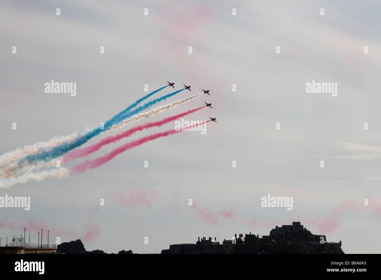 Five planes from the Red Arrows team fly over Elizabeth Castle and St ...