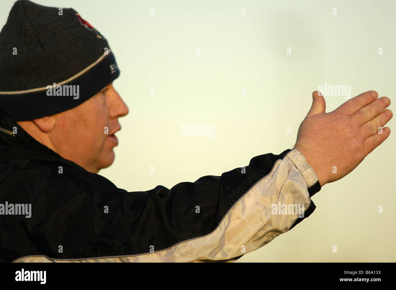 rugby coach watching a game and shouting instructions Stock Photo - Alamy