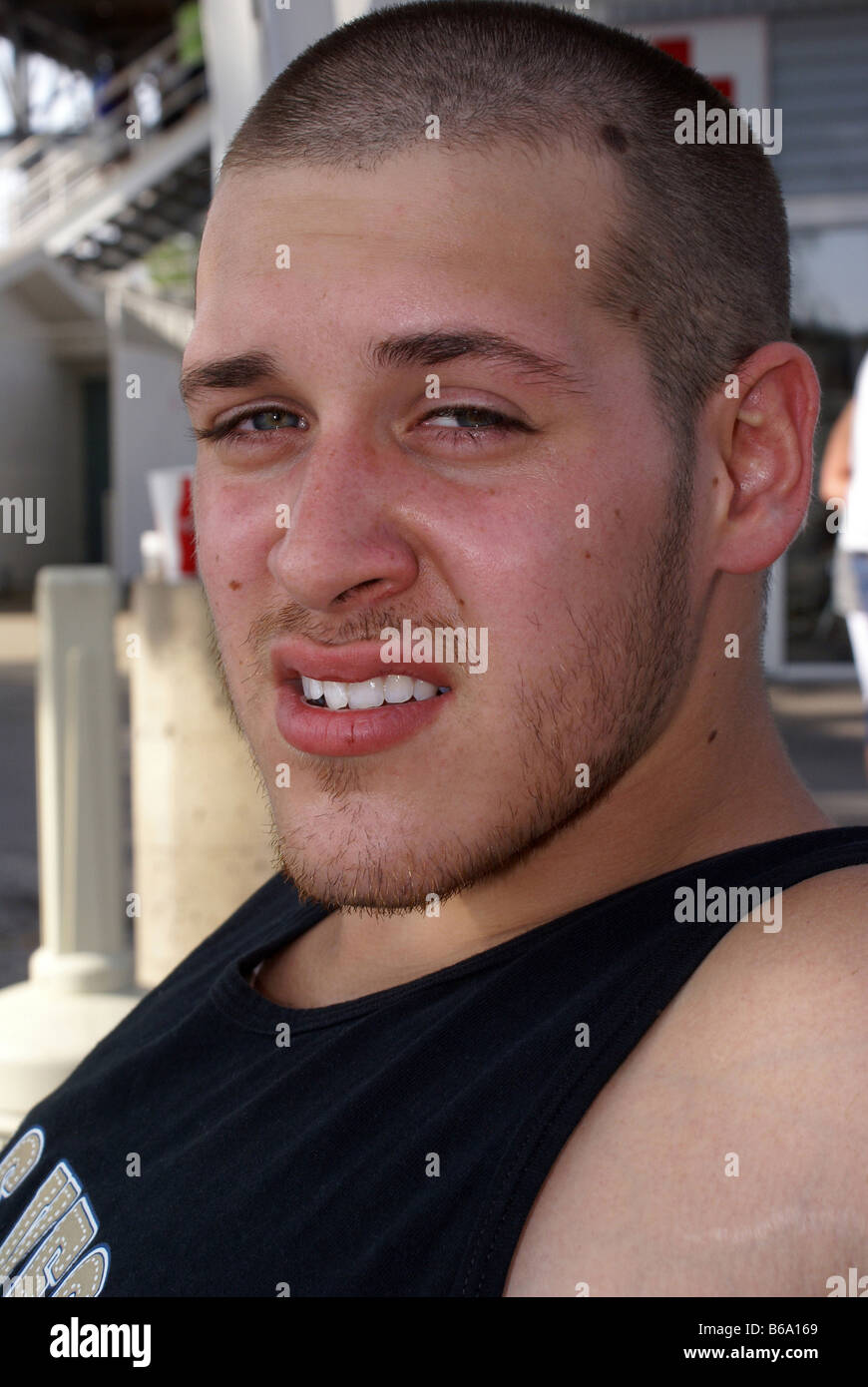 Squinting eyes teeth hi-res stock photography and images - Alamy