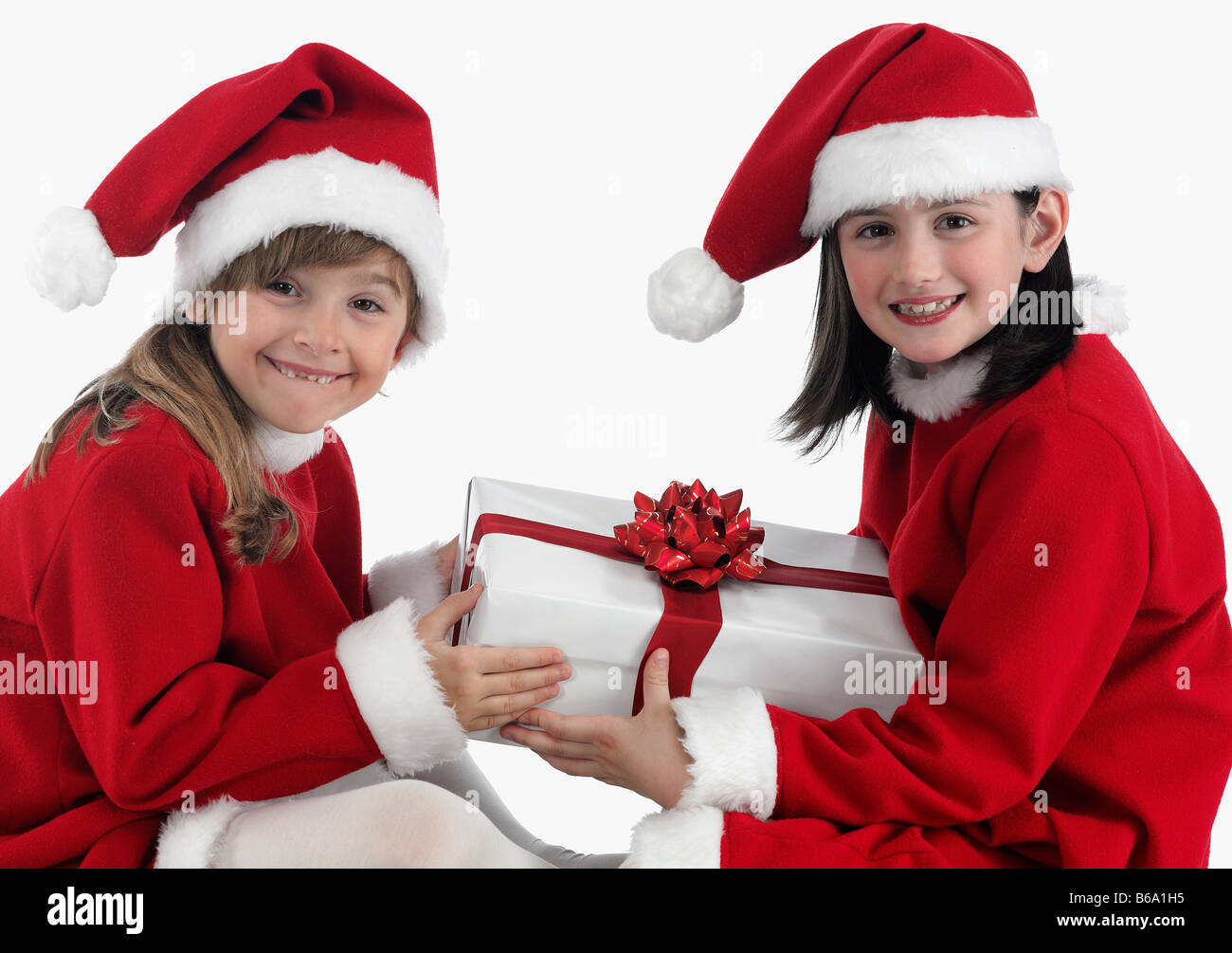 two girls dressed as Santa Claus isolated on white background Stock ...