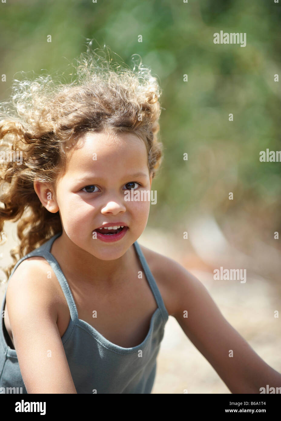 Young girl riding bicycle wind in hair Stock Photo - Alamy