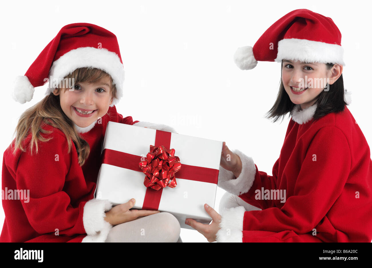 two girls dressed as Santa Claus isolated on white background Stock ...