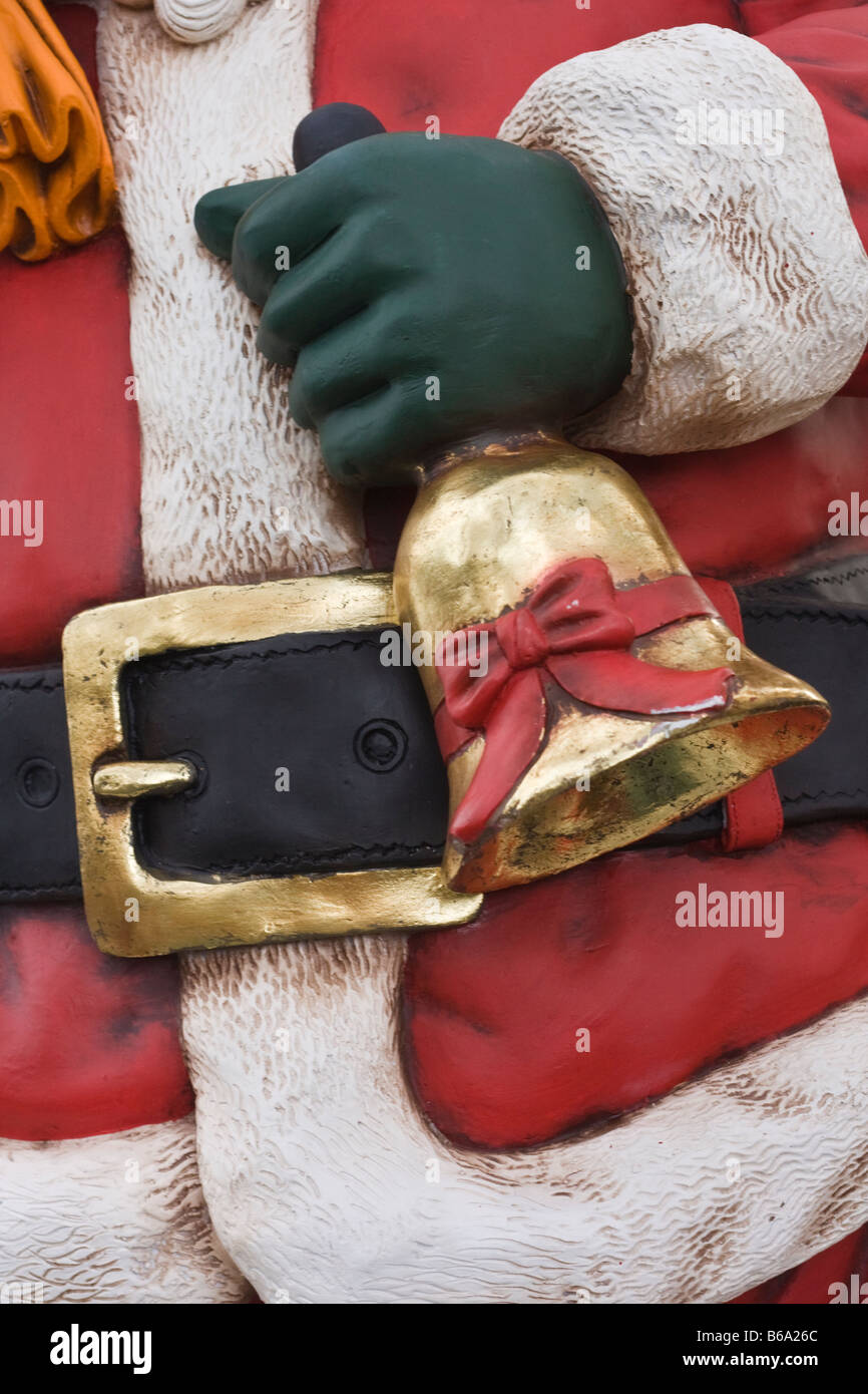 Close up of model of Father Christmas holding bell Stock Photo - Alamy
