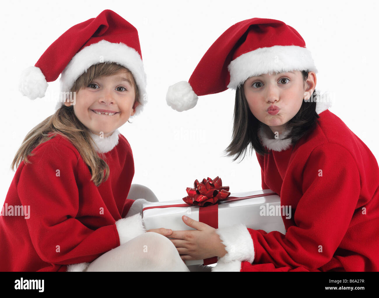 two girls dressed as Santa Claus isolated on white background Stock ...