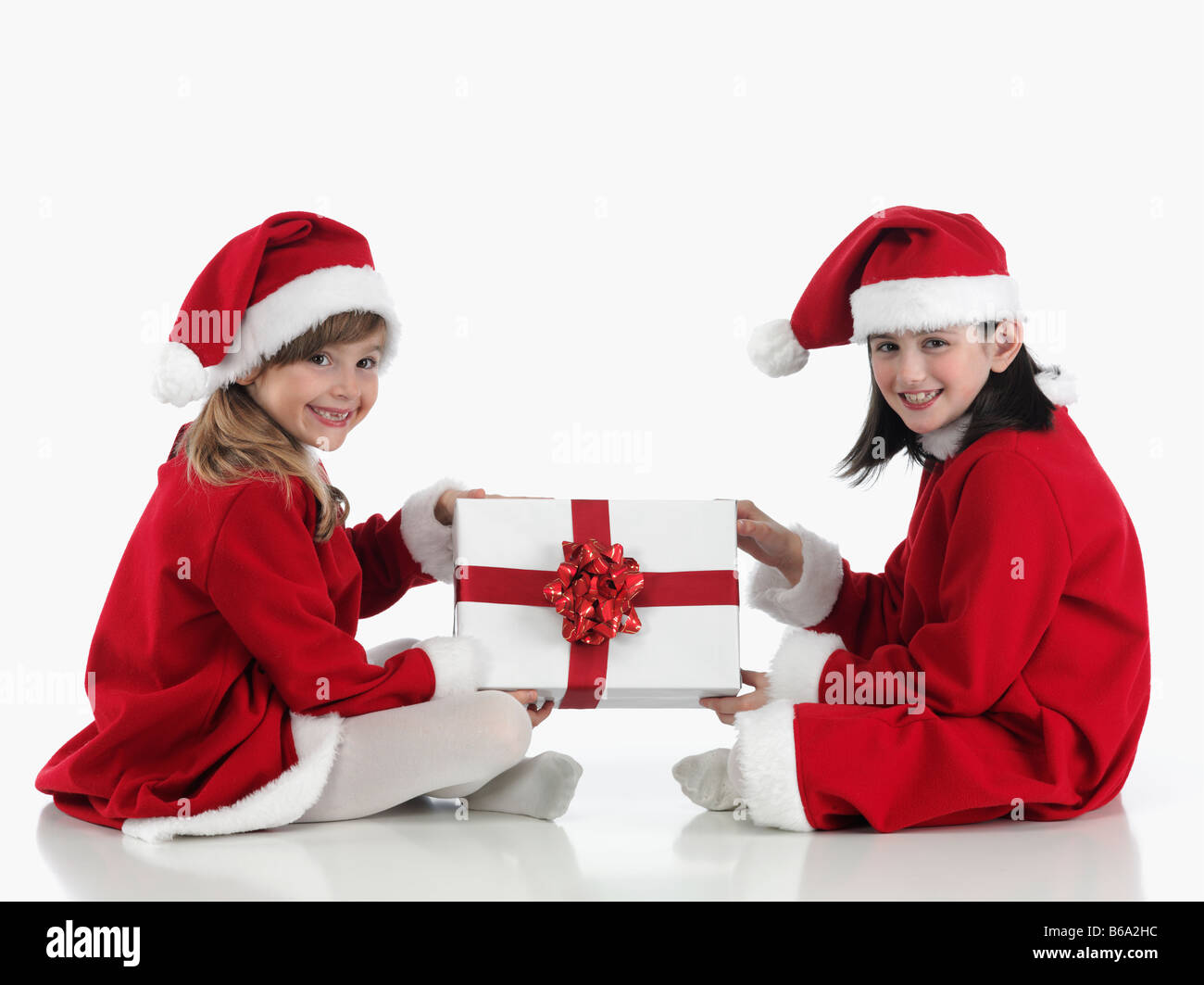two girls dressed as Santa Claus isolated on white background Stock ...