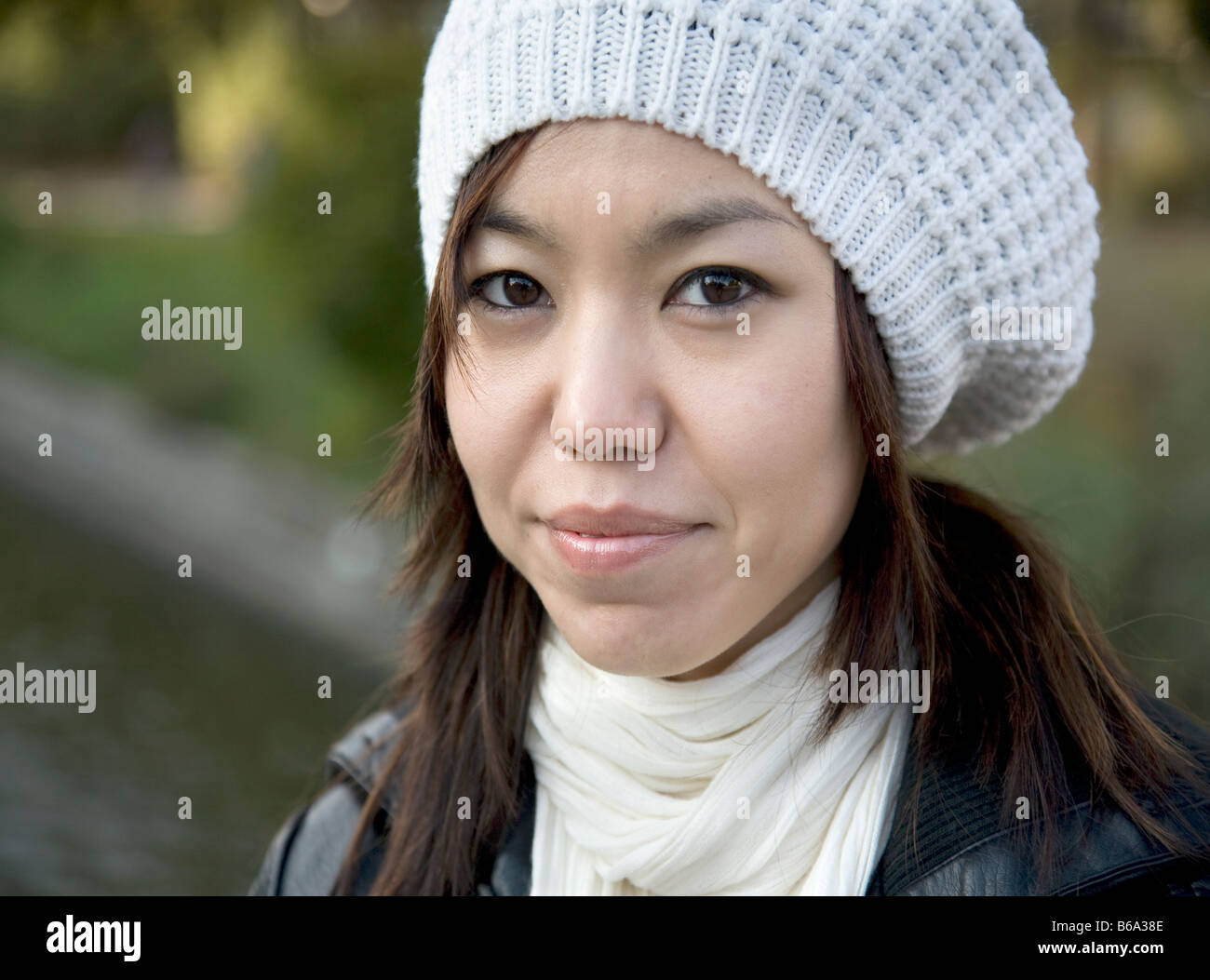 Russian oriental girl sat by a canal Stock Photo - Alamy
