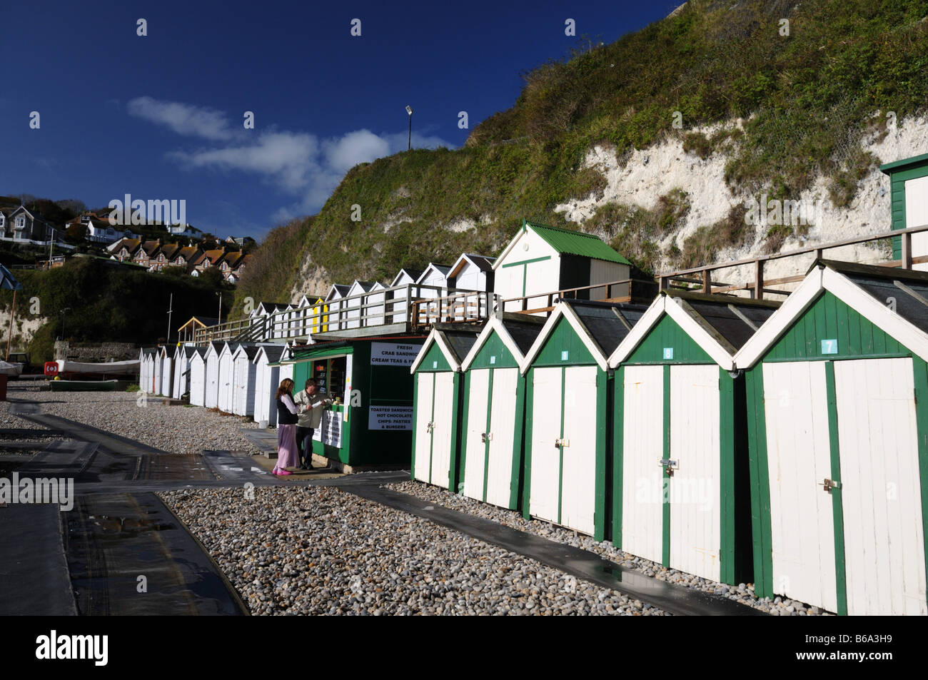 Cafe and beach huts on the Jurassic Coast at Beer, near Seaton, in ...