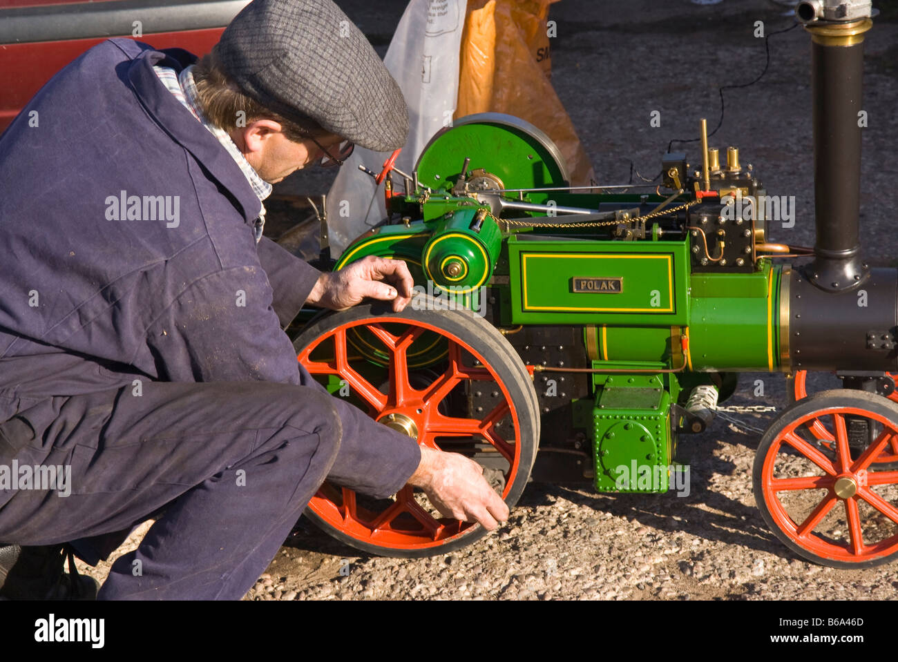 enthusiast cleaning his small steam engine Stock Photo - Alamy
