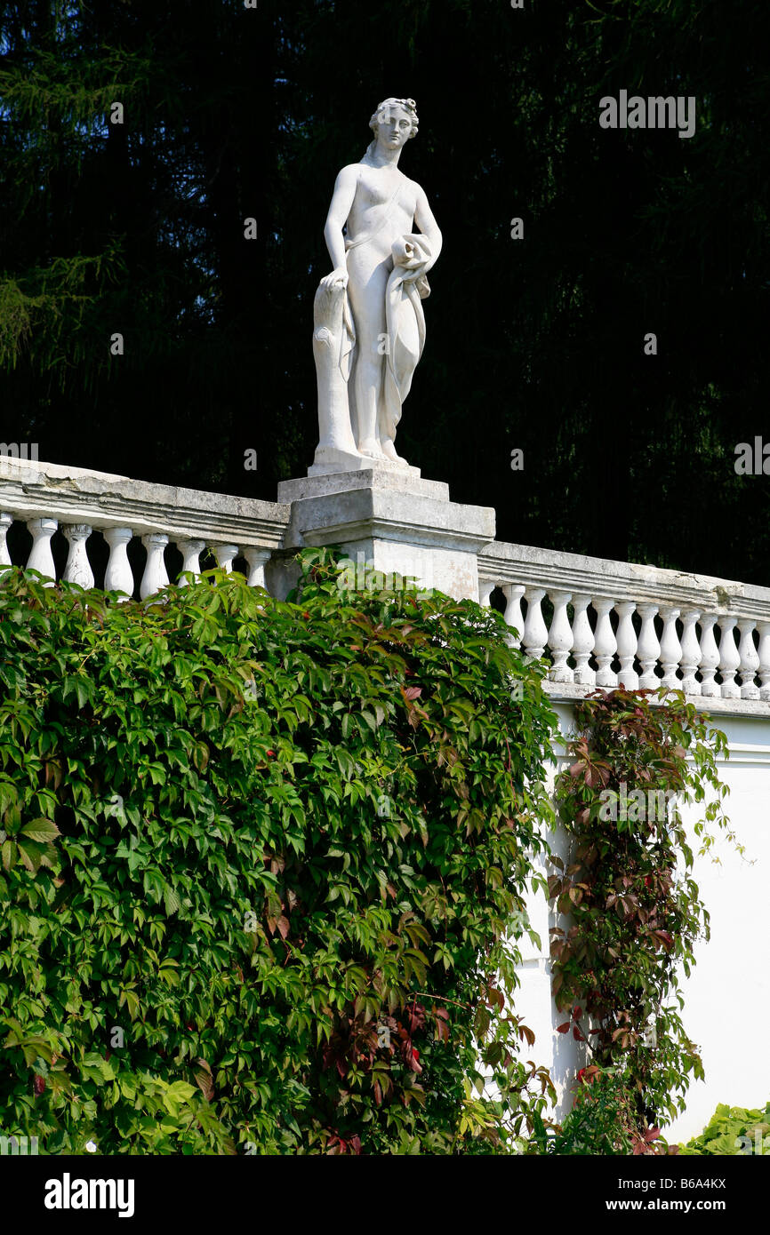 A neoclassical statue of a woman in the gardens of the 18th century ...
