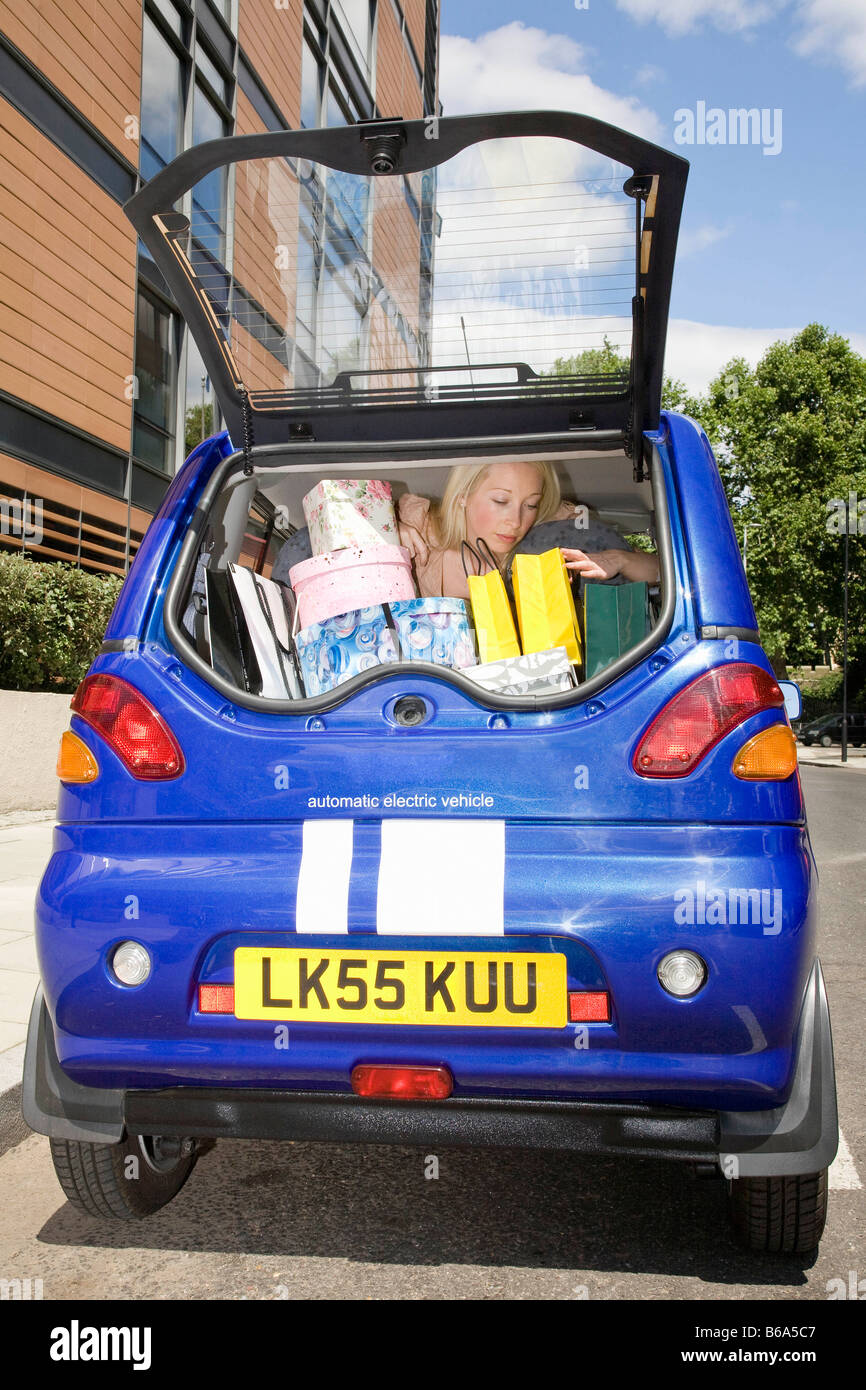 Female shopper loading car hi-res stock photography and images - Alamy