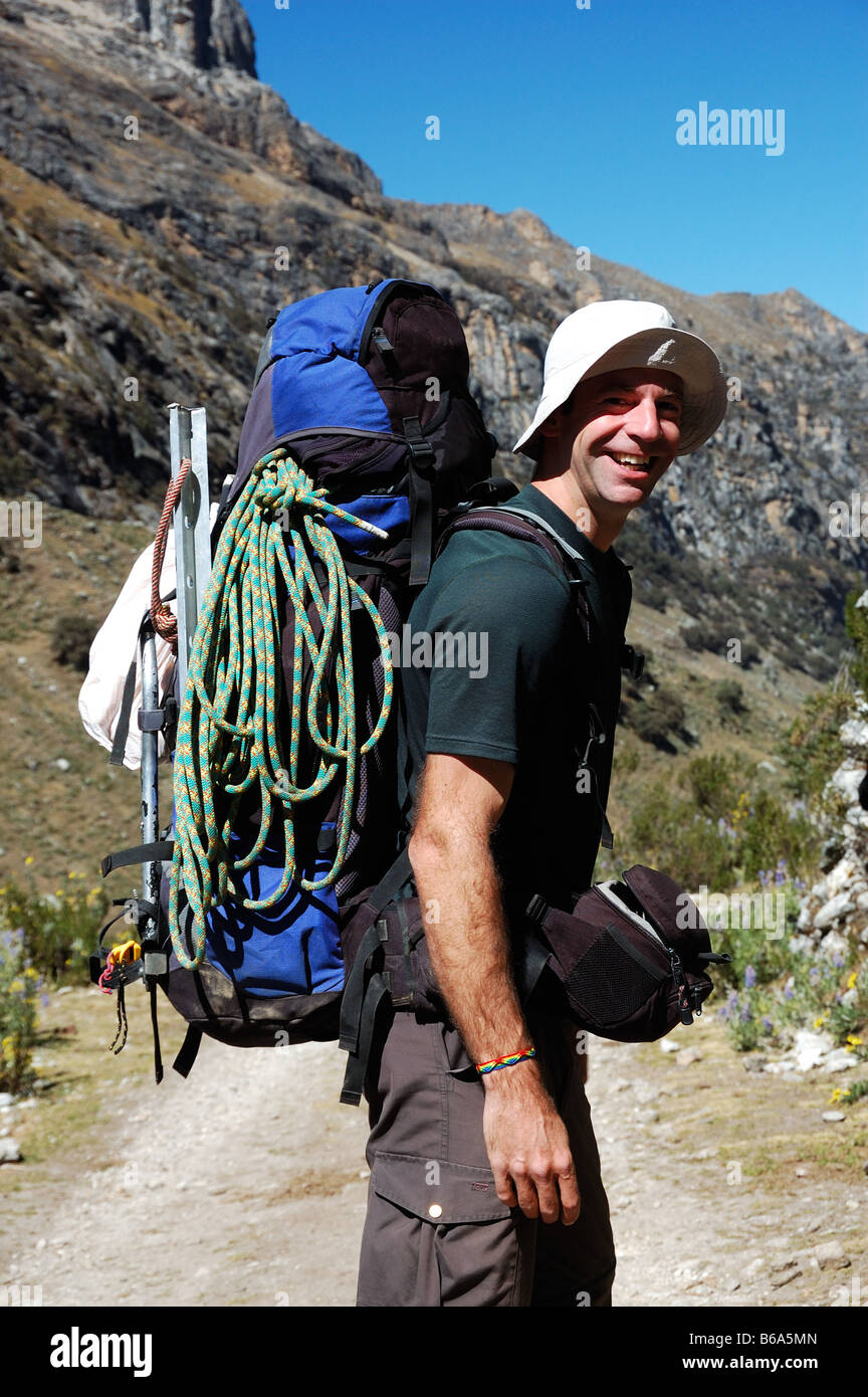Climber with packpack and climbing equipment approaching basecamp of ...