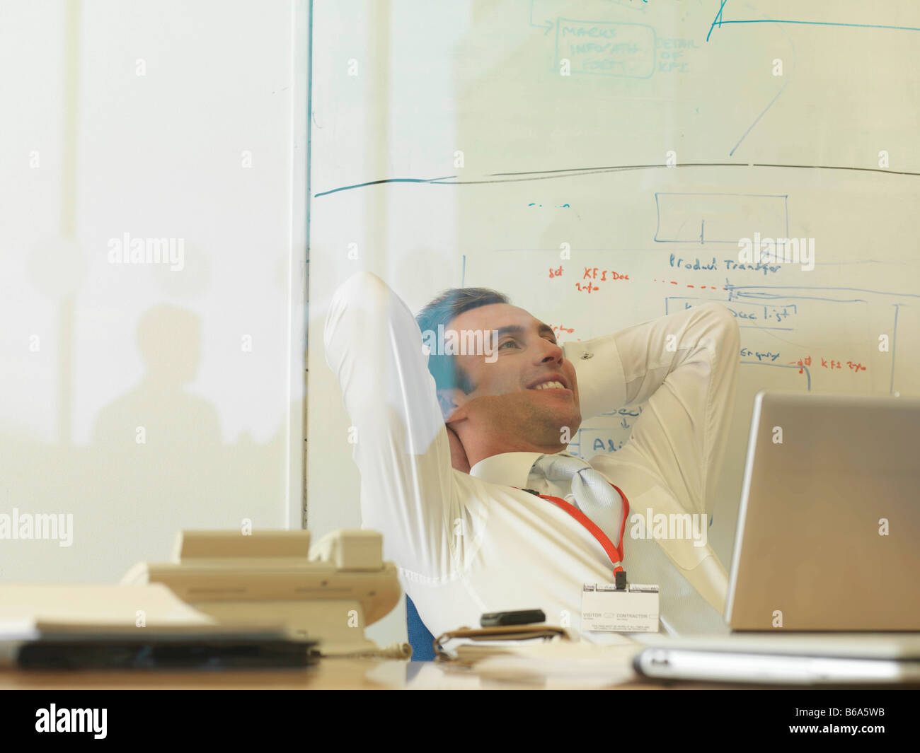 Man sitting behind desk front view hi-res stock photography and images ...