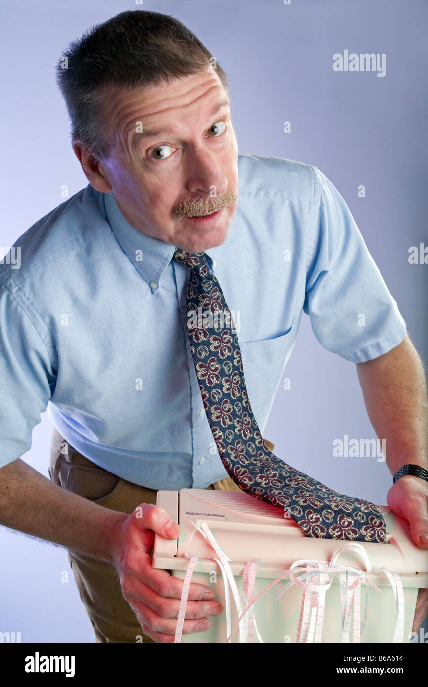 Paper shredder man hi-res stock photography and images - Alamy