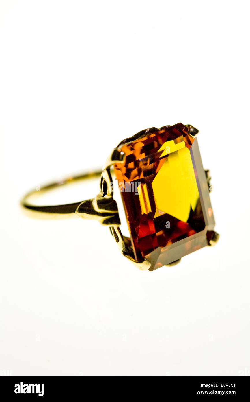 semi precious amber gem ring cut out on white background Stock Photo ...