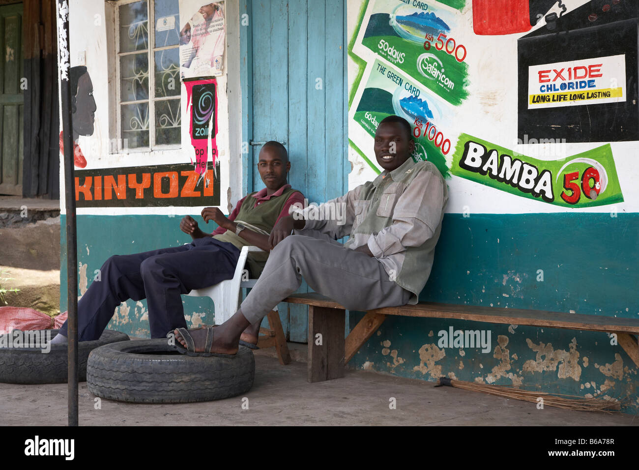Men sitting outside shop hi-res stock photography and images - Alamy