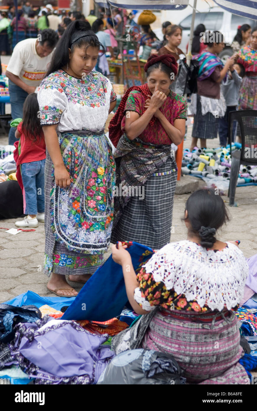 Indigenous women in colourful traditional dress on the market of Santa ...